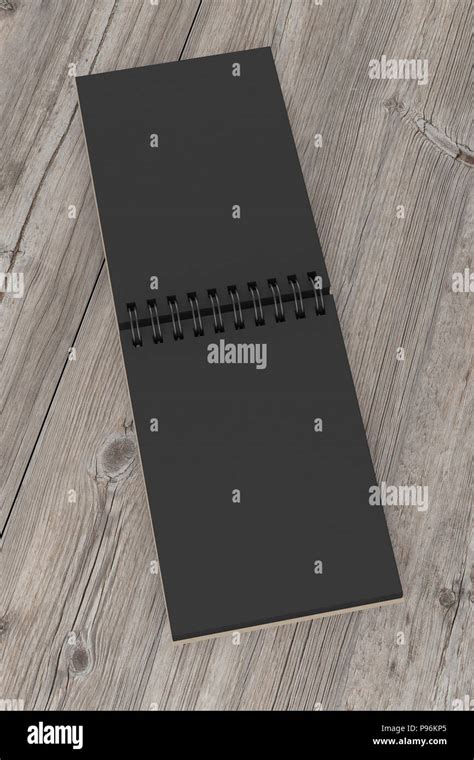 Black Spiral Notepad Isolated On Wooden Background Include Clipping