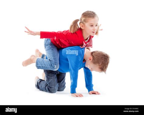 Brother And Sister Having Fun With Each Other Isolated On White Stock
