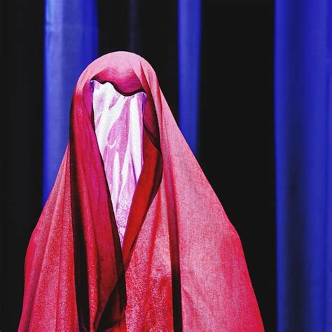 Premium Photo Close Up Of Red Fabric Against Blue Curtain