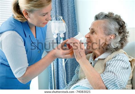 Nurse Cares Elderly Woman Lying Bed Stock Photo 74083021 Shutterstock