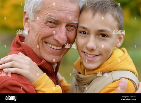 Grandfather And Grandson In Park Stock Photo Alamy