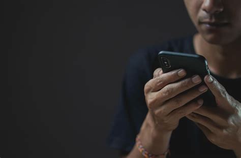 Premium Photo A Man Holding A Smart Phone