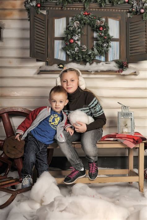 Brother And Sister In Front Of The House In Winter Stock Image Image Of Cheerful Family