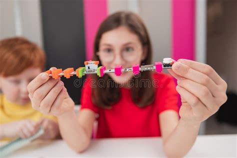Happy Schoolgirl Creating Robots In Classroom Stock Image Image Of Generation Programming
