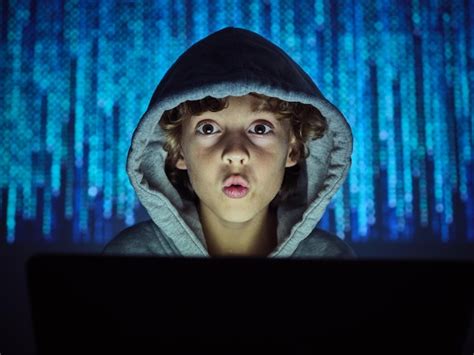 Premium Photo Boy With Laptop On Binary Code Background