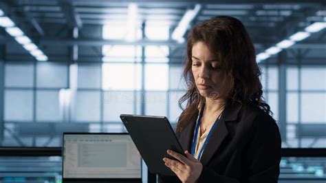 Technician In Data Center With Tablet Integrating Ai Driven Automation