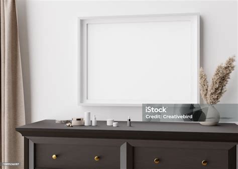 현대 침실에서 흰색 벽에 빈 사진 프레임 현대적인 스타일로 인테리어를 모의 뷰를 닫습니다 사진 포스터를 위한 여유 공간 콘솔 화병 팜파 잔디 화장품 3d 렌더링 비어 있음에