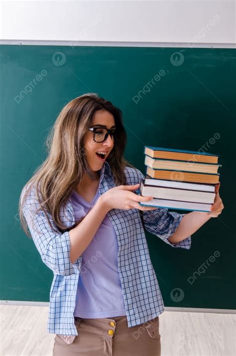 Female Student In Front Of Chalkboard Female Student In Front Of