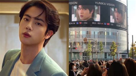 Японский блогер впечатлен большой светодиодной рекламой Джина создавшей толпу посреди Токио