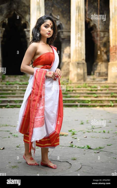 Portrait Of Beautiful Bengali Woman In Red And White Traditional Ethnic