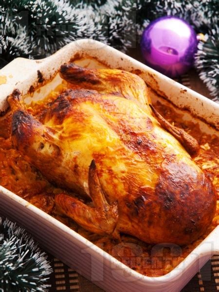 Пълнено коледно пиле с ориз и дробчета печено в тава с кисело зеле на