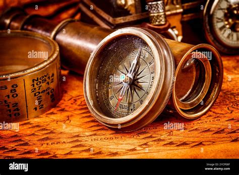 Vintage Compass Lies On An Ancient World Map Stock Photo Alamy