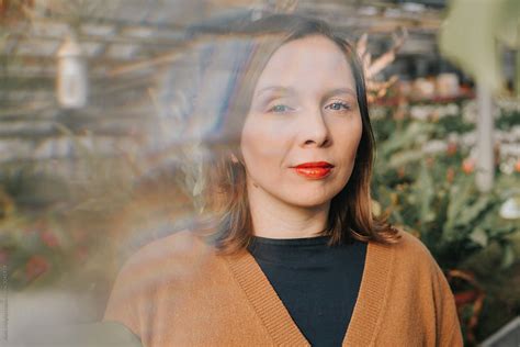 Affirmative Woman In A Greenhouse By Stocksy Contributor Anna