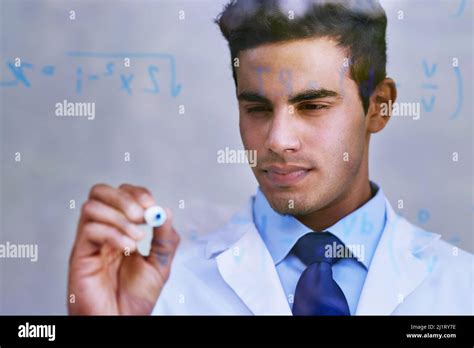 Formulating A New Hypothesiss Shot Of A Scientist Writing Formulas On