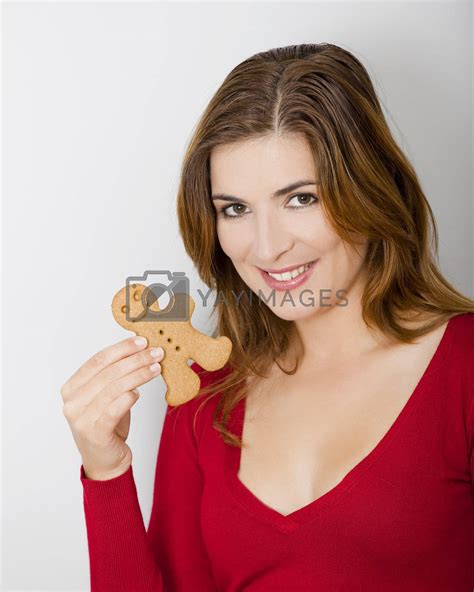 Woman With A Gingerbread Cookie By Iko Vectors And Illustrations With