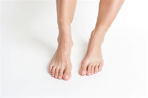 Premium Photo Closeup Of Bare Feet On White Background