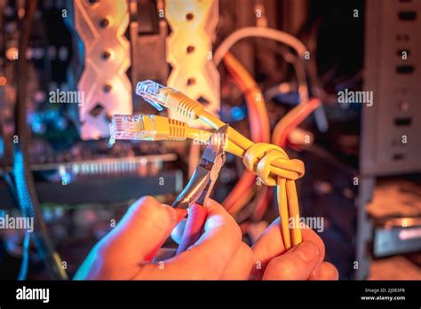 Cutting The Internet Cable Tied Into A Knot With Wire Cutters The