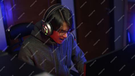 Premium Photo Male Cyber Hacker Gamer In Headphone Serious Face To