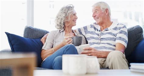 Retirement Relax And Senior Couple With Coffee Home And Bonding For