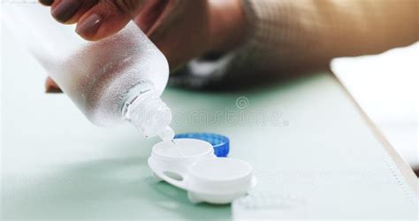 Hands Contact Lens And Bottle With Liquid Eye Care And Closeup For