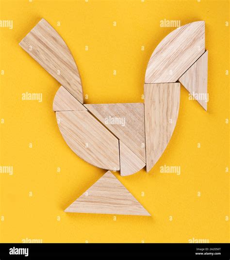 A Rooster Figure Is Assembled From Pieces Of A Tangram Puzzle Game Over