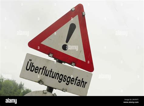 Warning Sign Flood And Danger Of Flooding Stock Photo Alamy