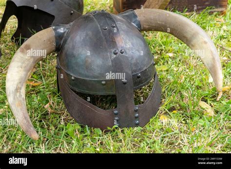 Medieval Viking Wrought Iron Helmet With Horns Placed On The Ground