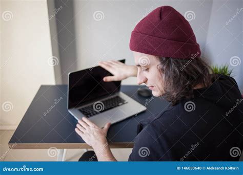 Frustrated User Closes The Laptop A Young Programmer In The Workplace
