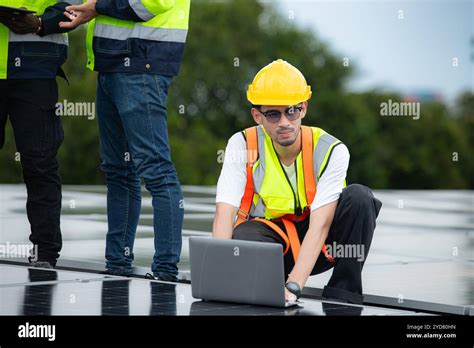 Group Of Engineer And Technician Inspects Solar Panel Installation And Test The Operation Of The
