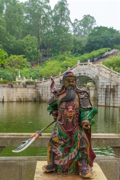 The Guan Gong Gun Gng Colored Porcelain Statue Stands Tall Within