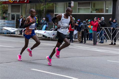 Kenyan Athlete Dickson Chumba And A Pacer Running The Chicago Marathon