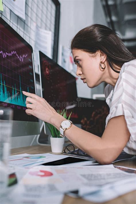 Selective Focus Of Data Analyst Looking At Charts On Computer Monitor