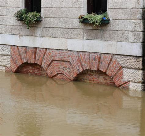 Wall And Entrance Of The House Are Completely Submerged By The Muddy