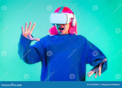 Young Asian Girl Pink Color Hairstyle In Blue Sweatshirt Wearing White Vr Headset Watching