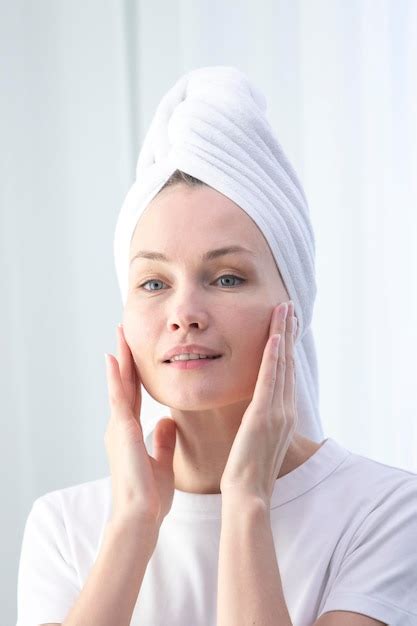 Premium Photo Middle Aged Woman After A Shower In A Towel Does Home