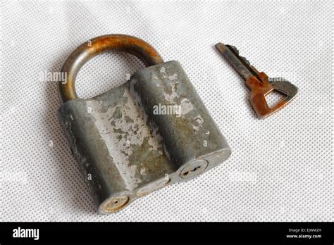 Closed Old Rusty Padlock With A Key Stock Photo Alamy