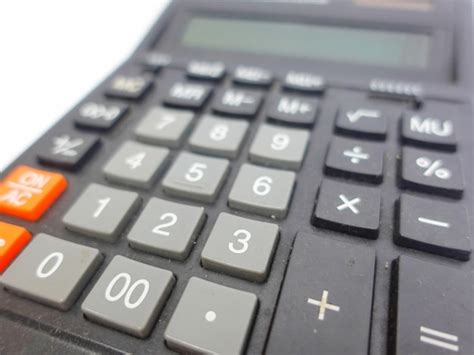 Premium Photo A Black Calculator With A Red Button That Says X On It