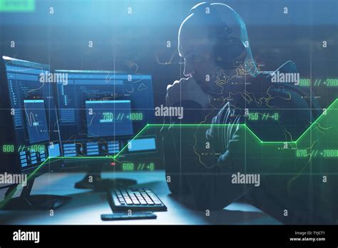 Hacker With Progress Bar On Computers In Dark Room Stock Photo Alamy