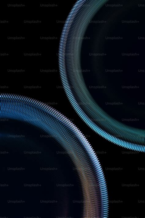 A Close Up Of Two Circular Objects On A Black Background Photo