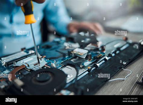 Screwdriver Motherboard Circuit Or Information Technology Man Fixing Laptop Hardware