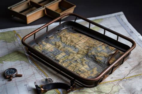 Worn Metal Detector Frame With Toolkit And Treasure Map In The Background Stock Illustration