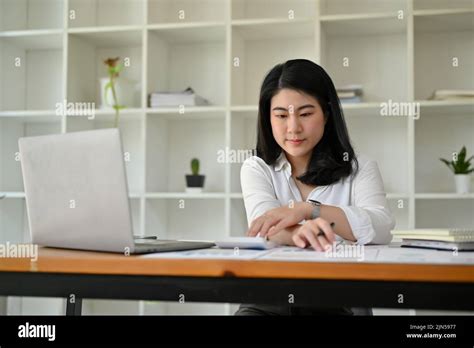 Thoughtful And Professional Asian Businesswoman Or Female Manager At