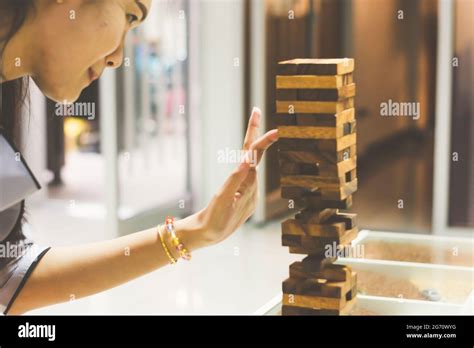Close Up Woman Playing Jenga Block For Business Success Concept Stock Photo Alamy