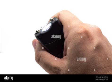 Taser In A Man Hand Close Up Isolated On A White Background Stock