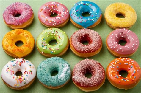 donut doughnut of different colors on a green background with multi