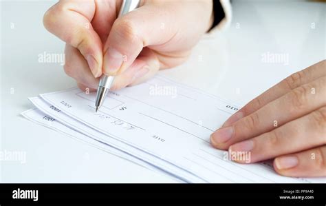 Woman Signing Cheque Hi Res Stock Photography And Images Alamy