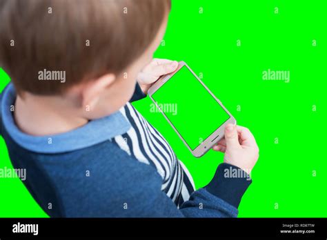 Kid holding smart phone in horizontal position. Isolated screen and ...
