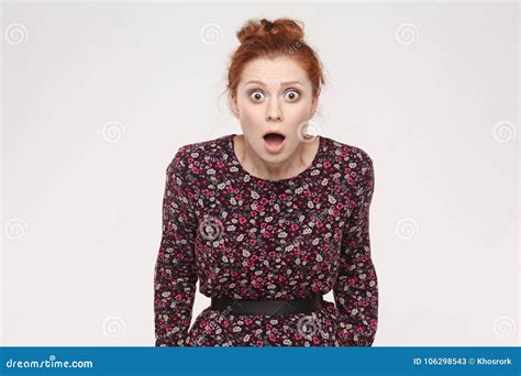 Amazement Redhead Young Woman Is Shocked Open Mouth And Big Eye Stock