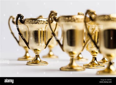 Gold winners achievement trophy background Stock Photo - Alamy