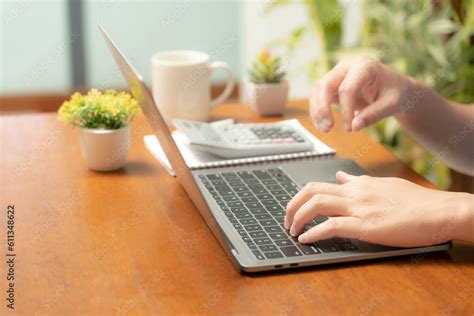 the busy businessman efficiently manages his work by skillfully utilizing his laptop mobile